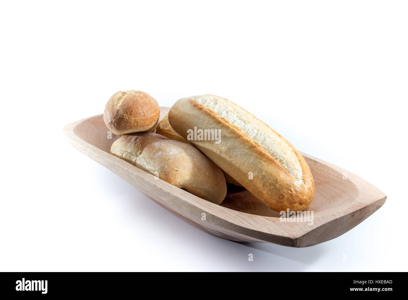 Mini French Baguettes on a rectangular wood bowl with white background ...