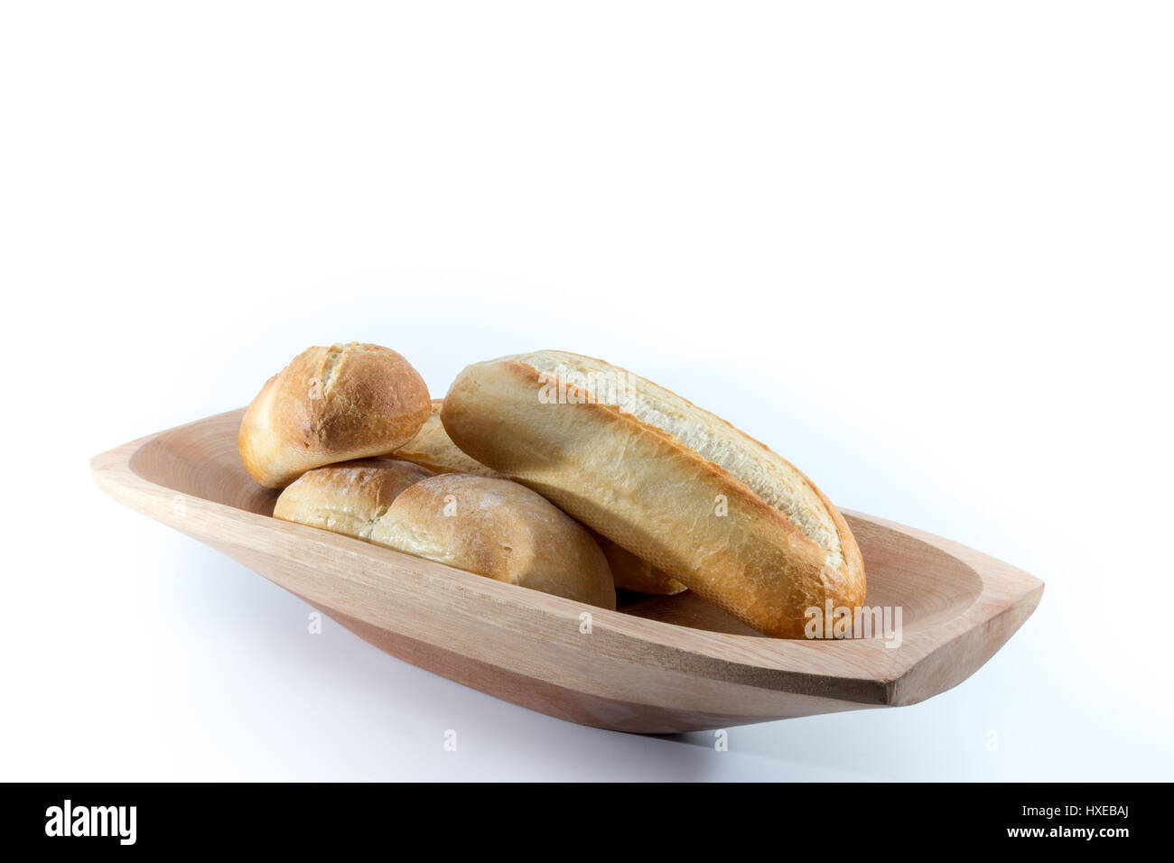 Mini French bread on a rectangular wood bowl with white background ...