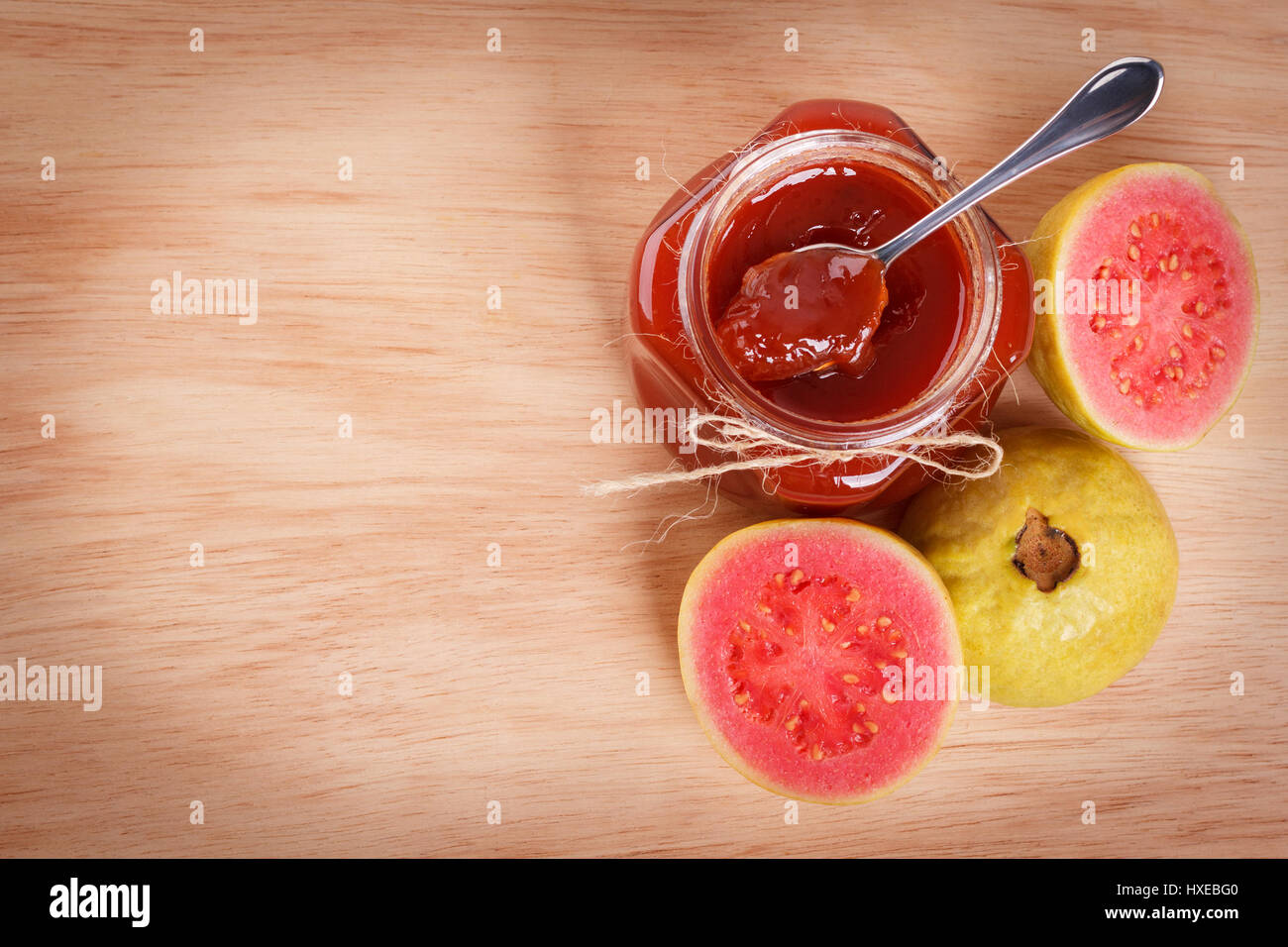 Brazilian dessert goiabada - jam of guava with fresh goiaba on wooden ...