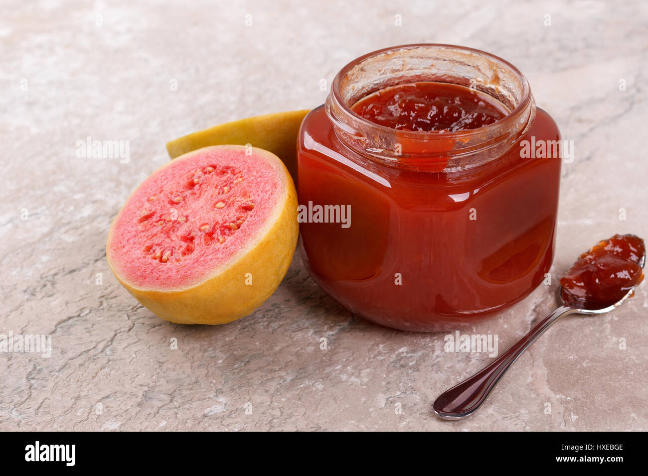 Brazilian dessert goiabada - jam of guava with fresh goiaba on gray ...