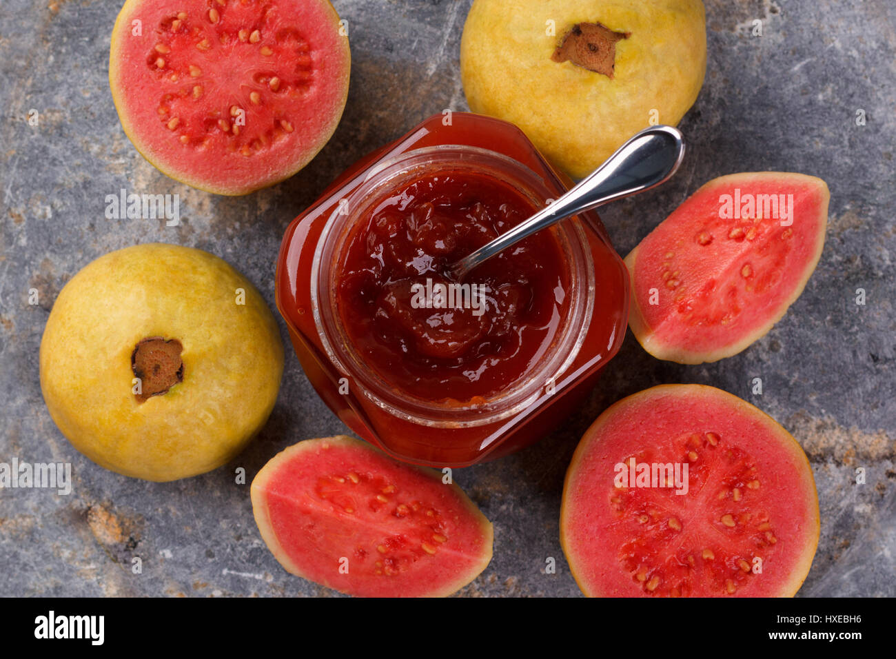 Brazilian dessert goiabada - jam of guava with fresh goiaba on gray ...