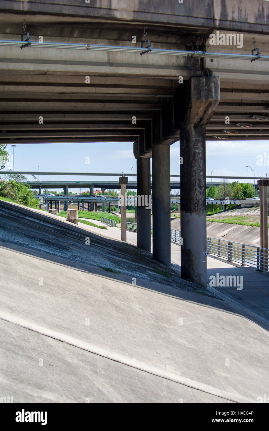 A trail in Buffalo Bayou Park that goes under the bridges Stock Photo ...