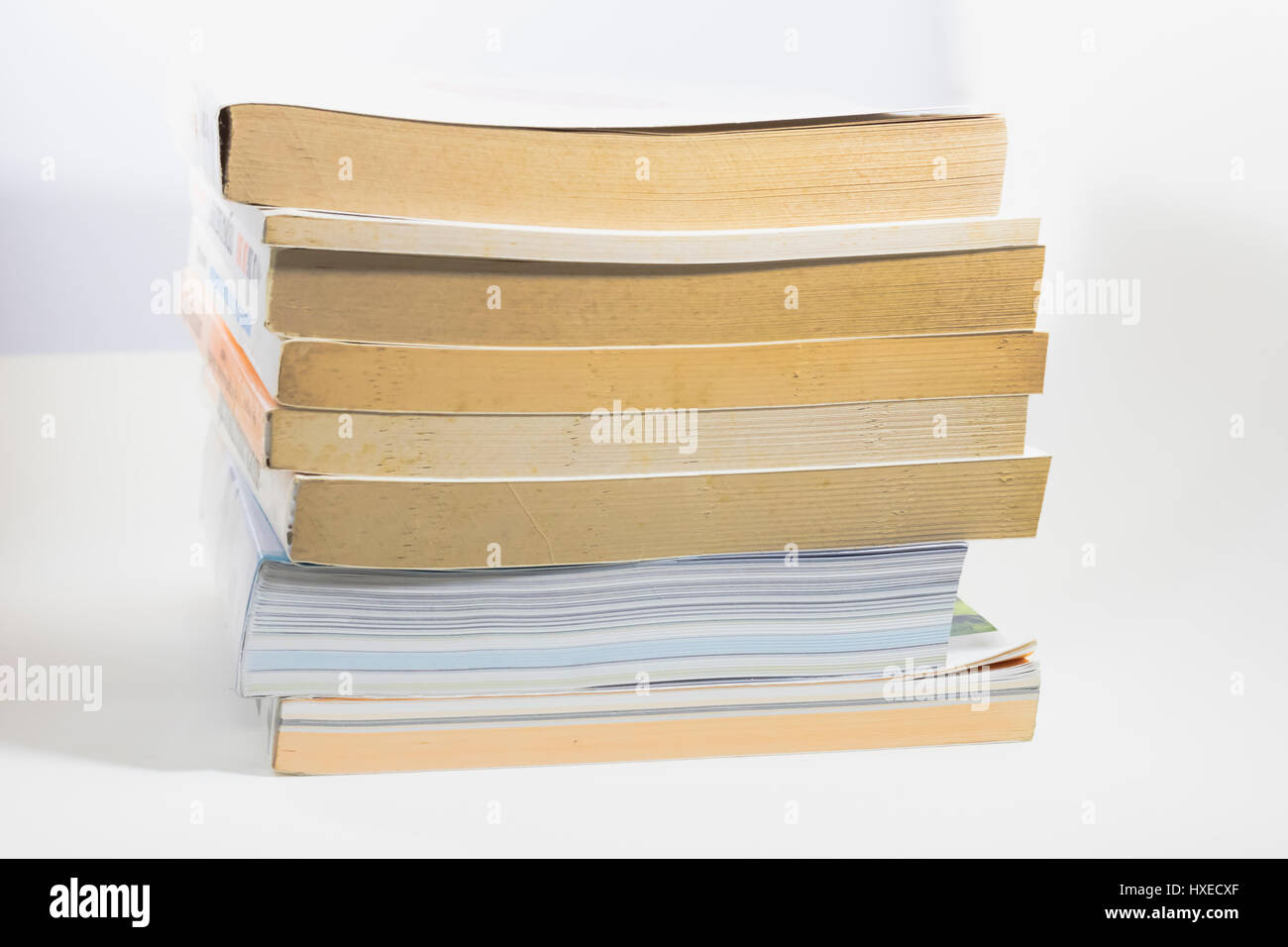 Many books set up on white background Stock Photo - Alamy