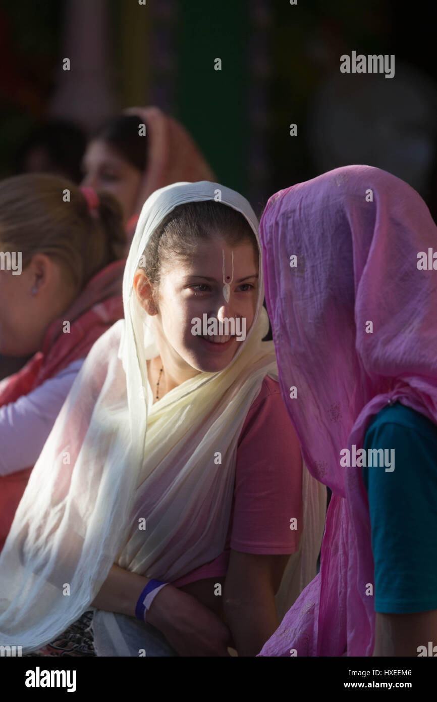 Female Krishna devotees talk intimately Stock Photo - Alamy