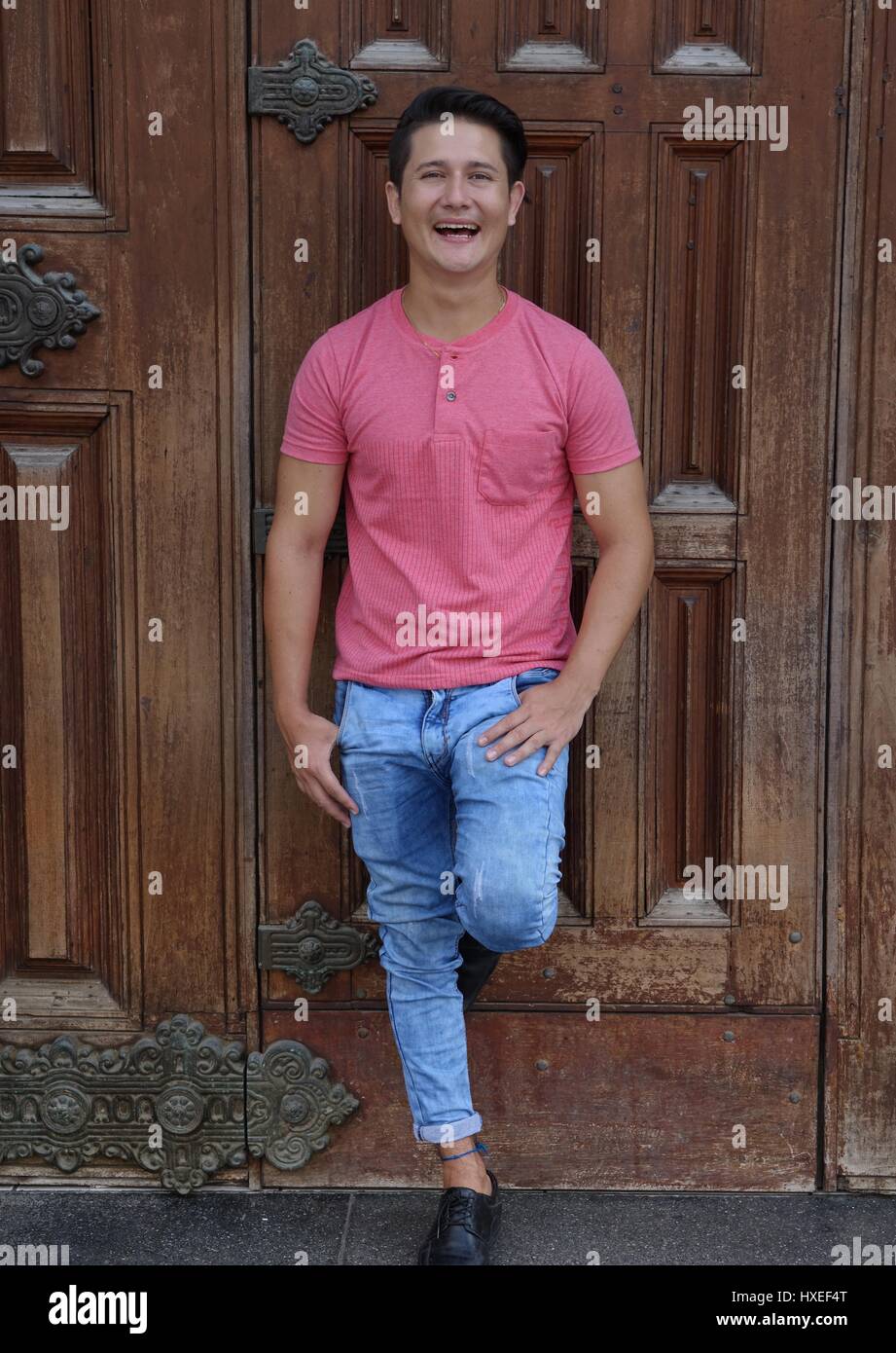 Smiling hispanic man standing hi-res stock photography and images - Alamy