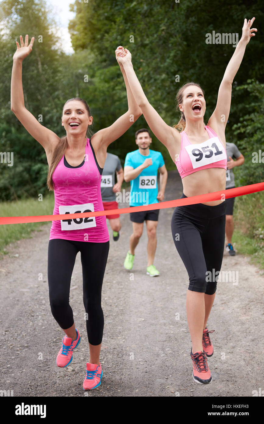 Winners on the finishing line Stock Photo - Alamy