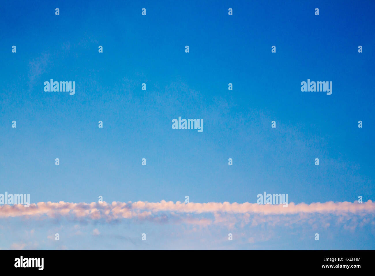 Clouds Lay Horizontally On Clear Blue Sky Stock Photo - Alamy