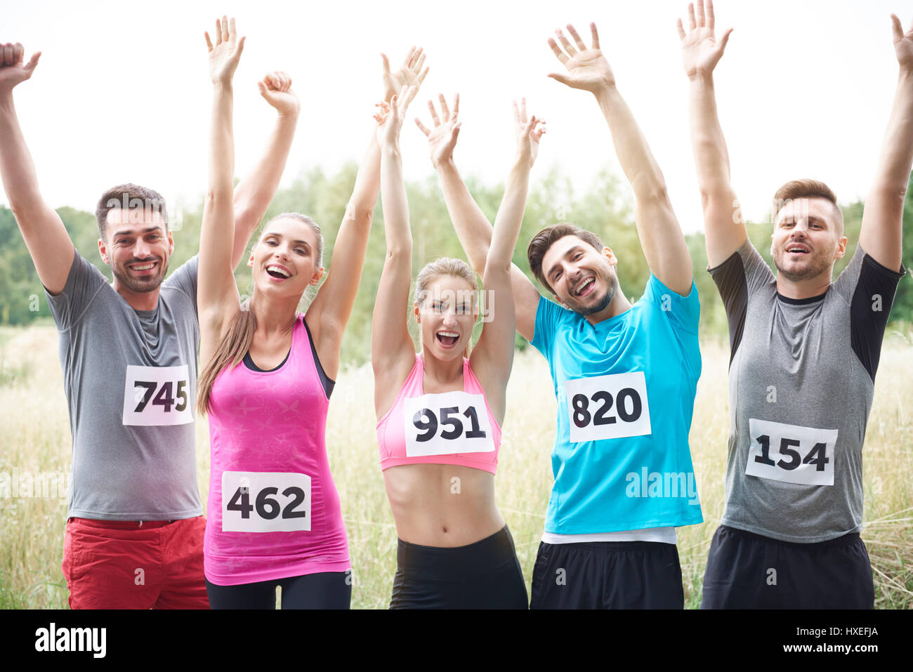 Happy team after the marathon Stock Photo - Alamy