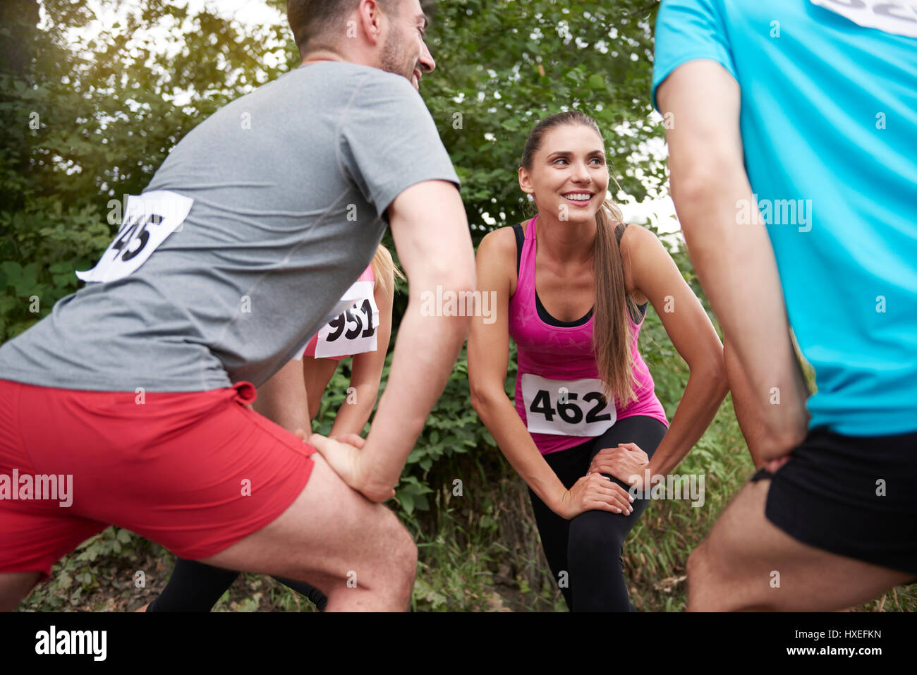 Legs stretching of running people Stock Photo - Alamy