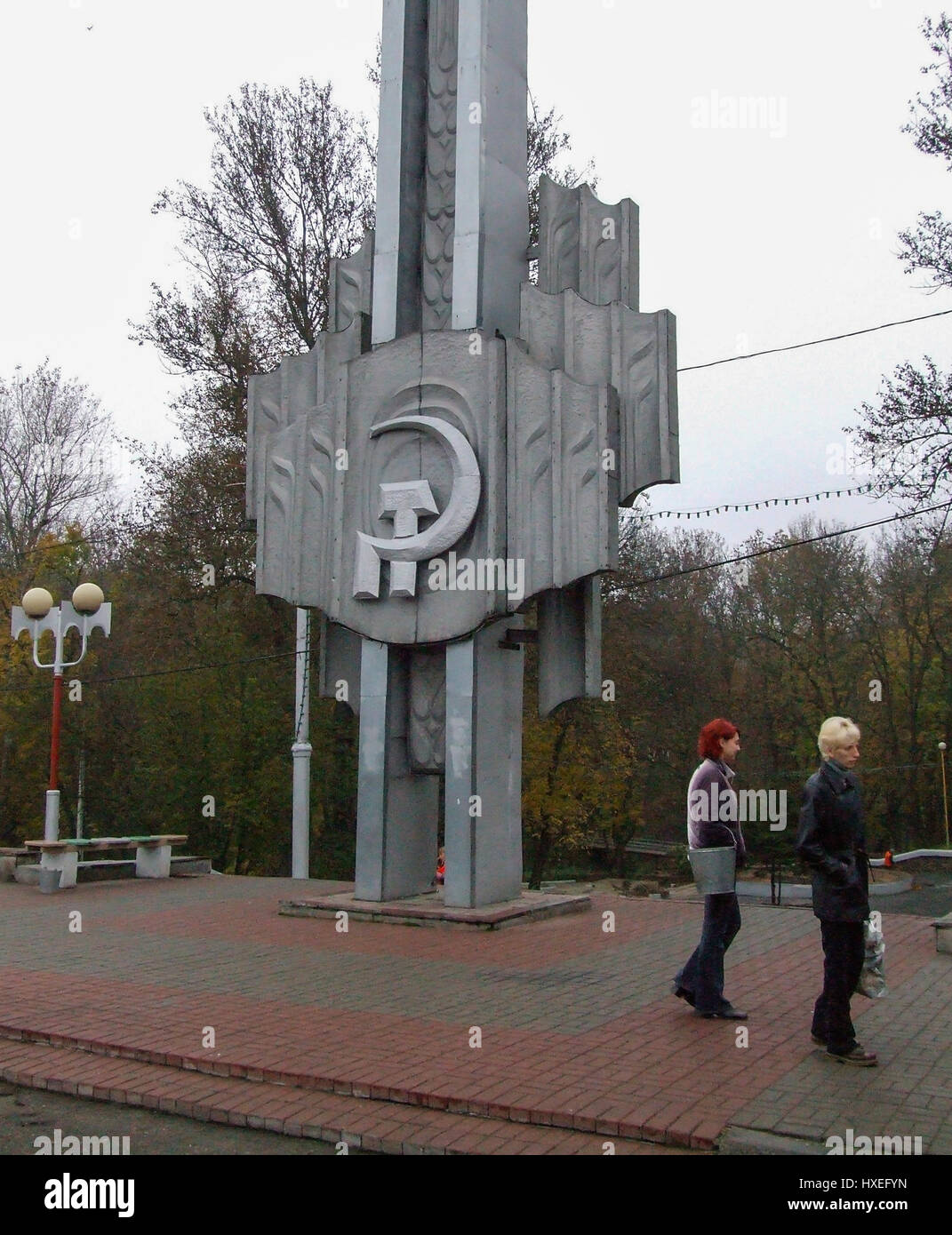 A communist monument with hammer and sickle decorates the park in ...