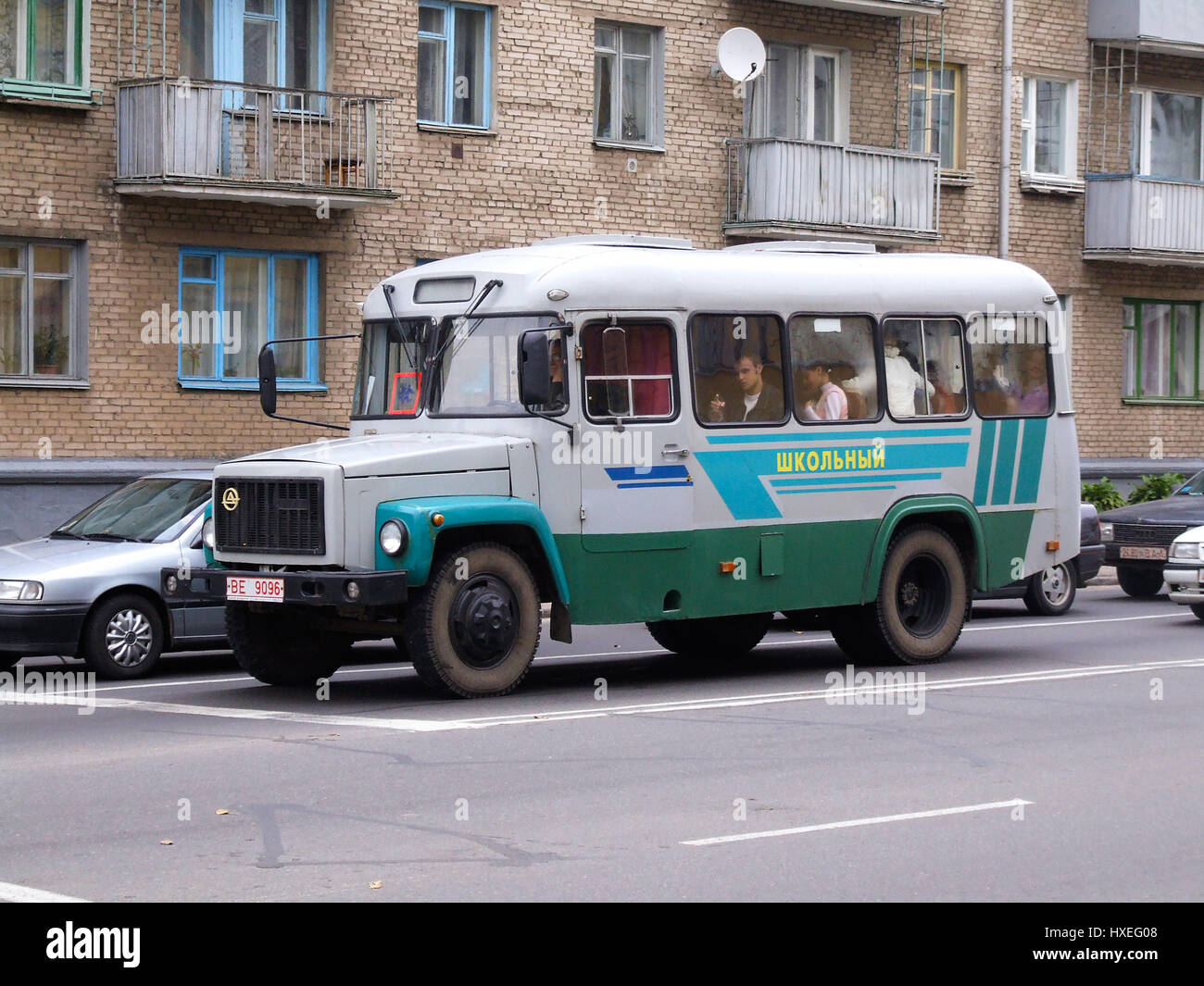 Public bus on the street in Vitebsk, Belarus. Behind is a government ...