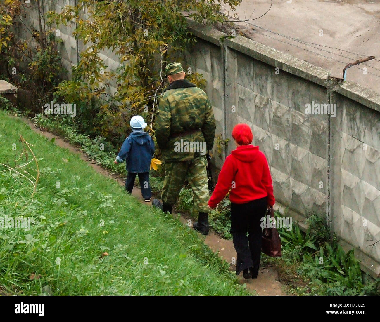 A soldier and his family walk along a path in Vitebsk, Belarus Stock ...