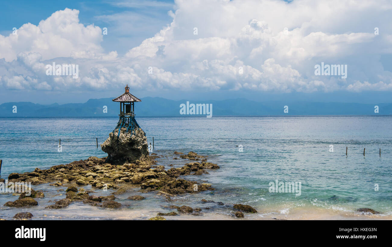 Cute Temple on the Shore by the Sea on Nusa Penida with Dramatic Clouds ...