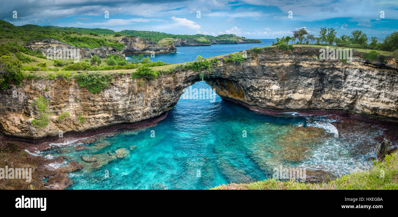 Stone arch over the sea. Broken beach, Nusa Penida ,Indonesia Stock ...