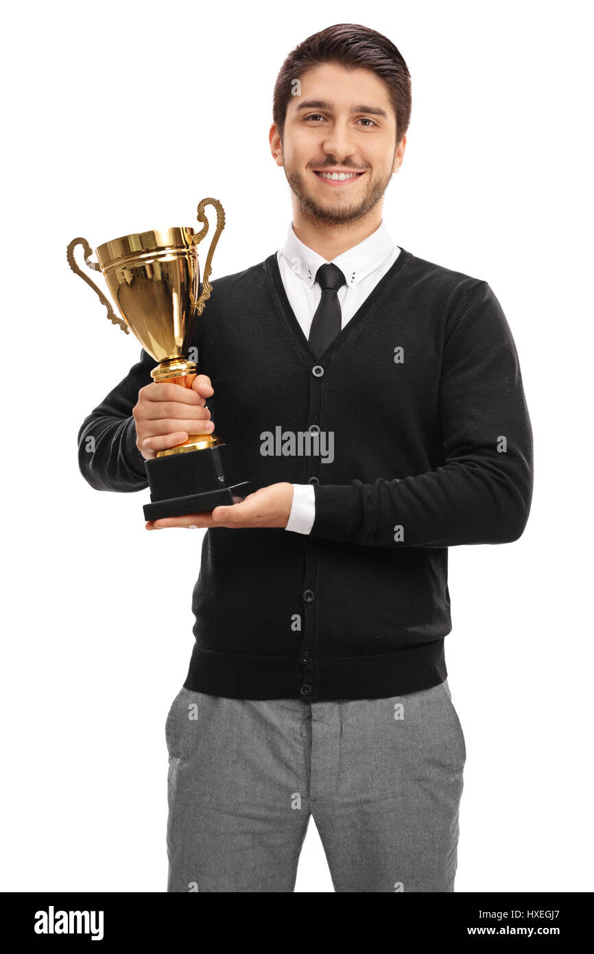 Happy guy holding a golden cup isolated on white background Stock Photo ...