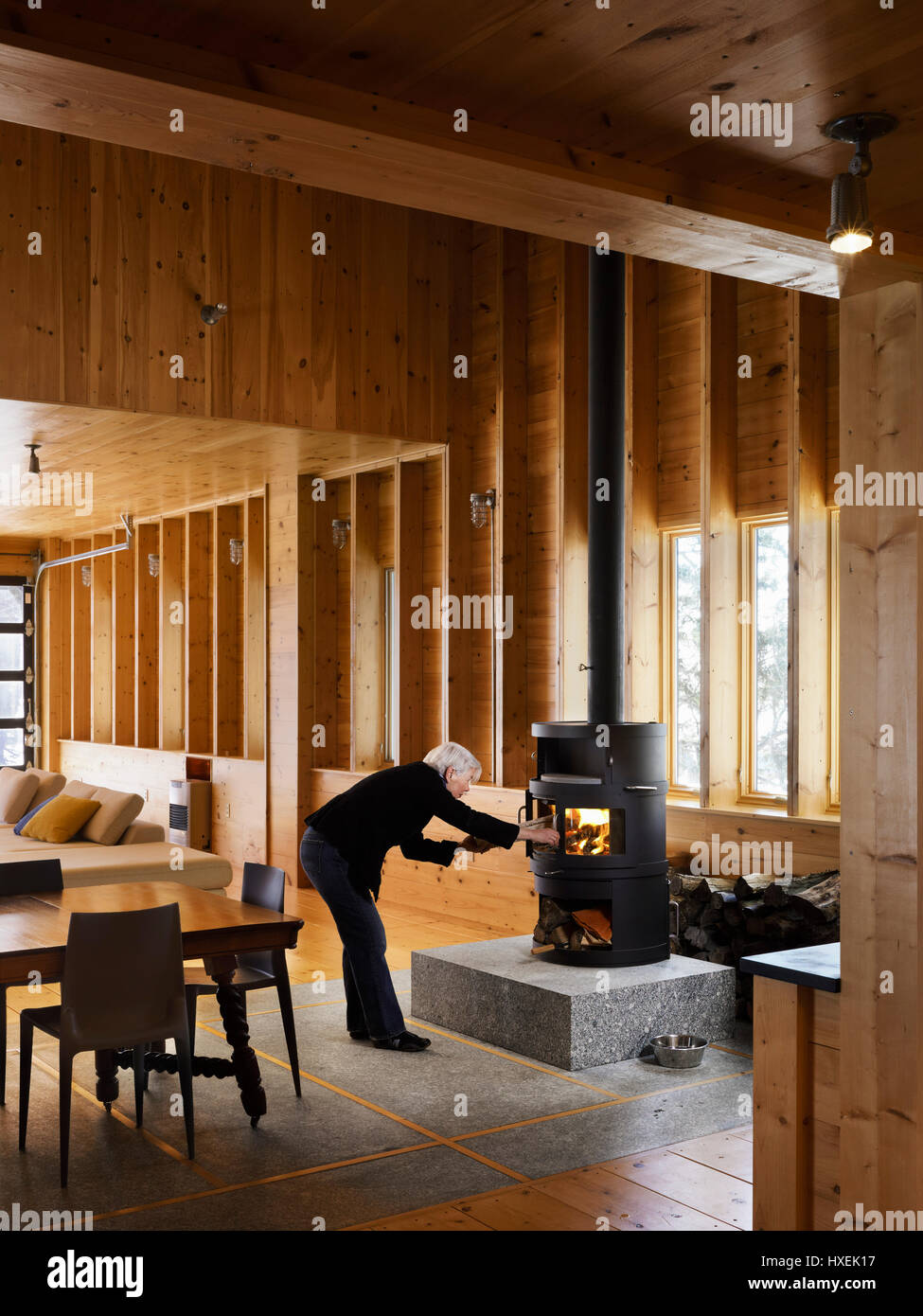 Woman woodburning stove hi-res stock photography and images - Alamy