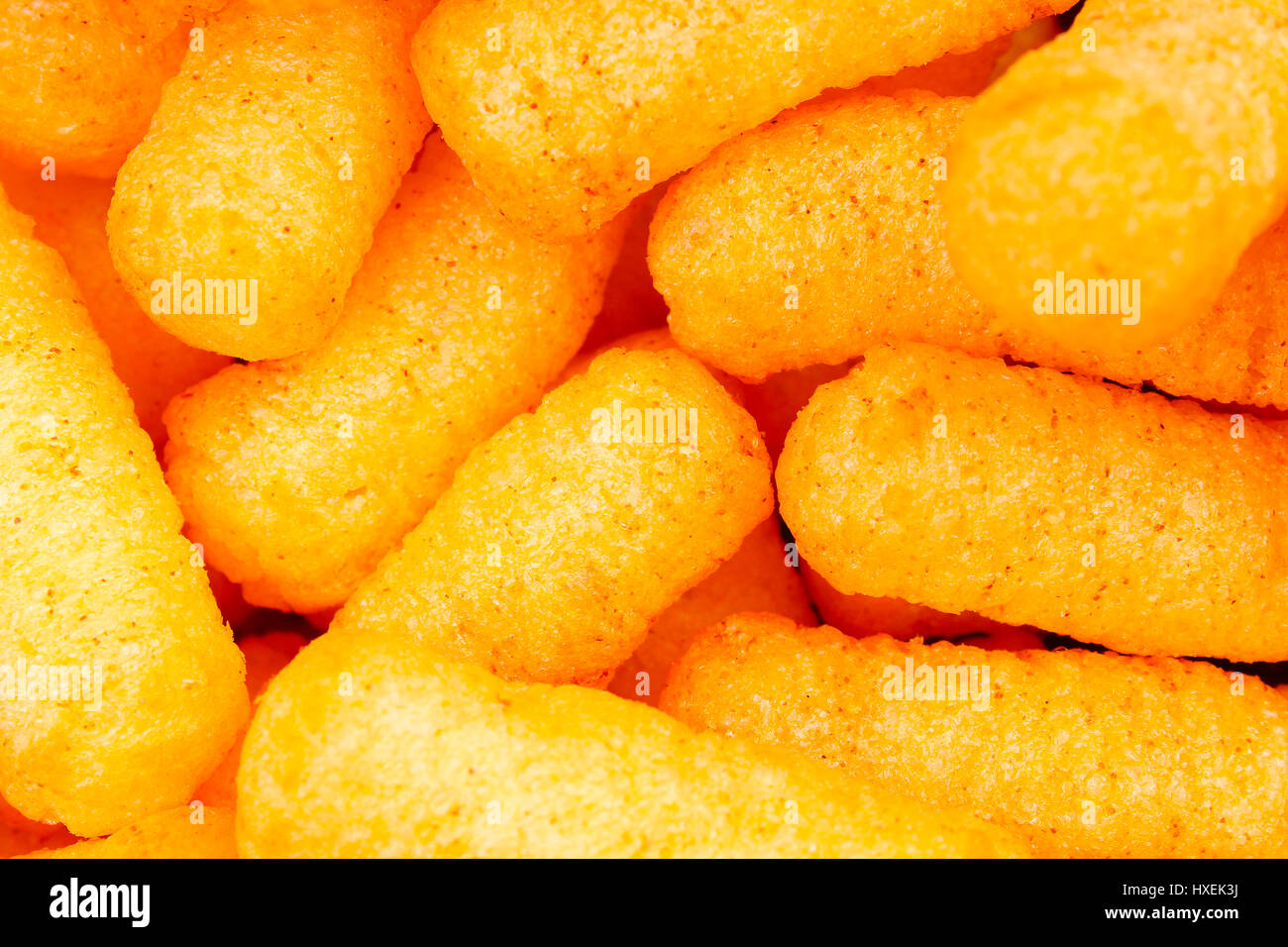 Cheese puff. Cheese puffs snack background texture food pattern Stock ...