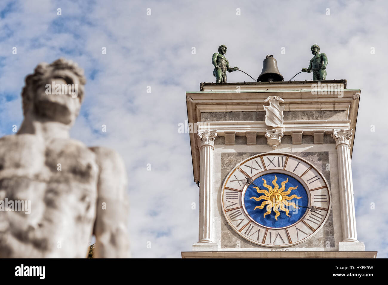 Clock tower with bell. Blurred in foreground the Hercules Statue Stock ...