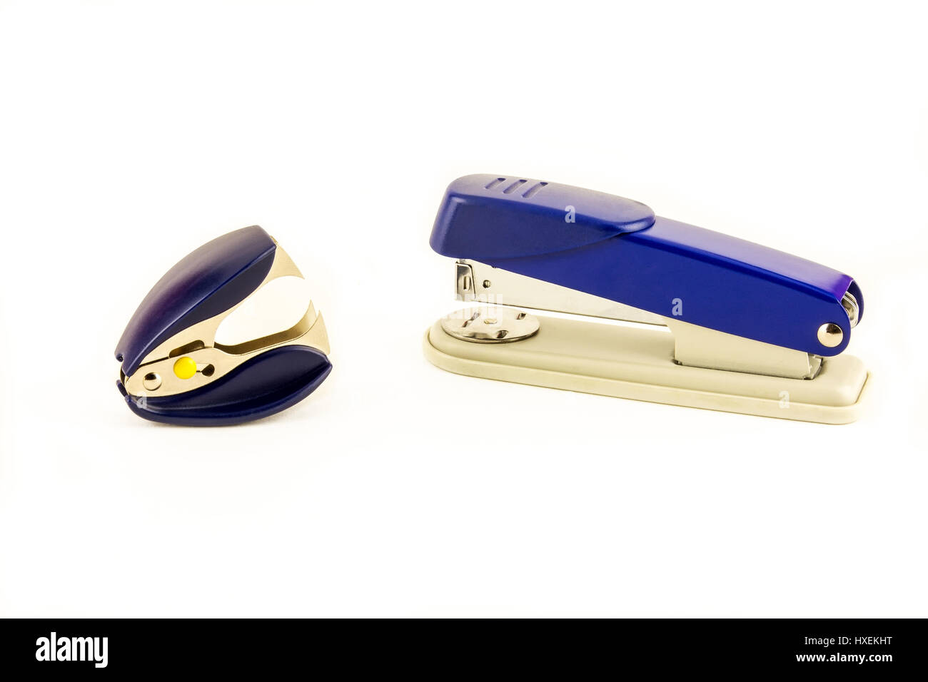 A stapler and anti-stapler lie on a white background Stock Photo - Alamy