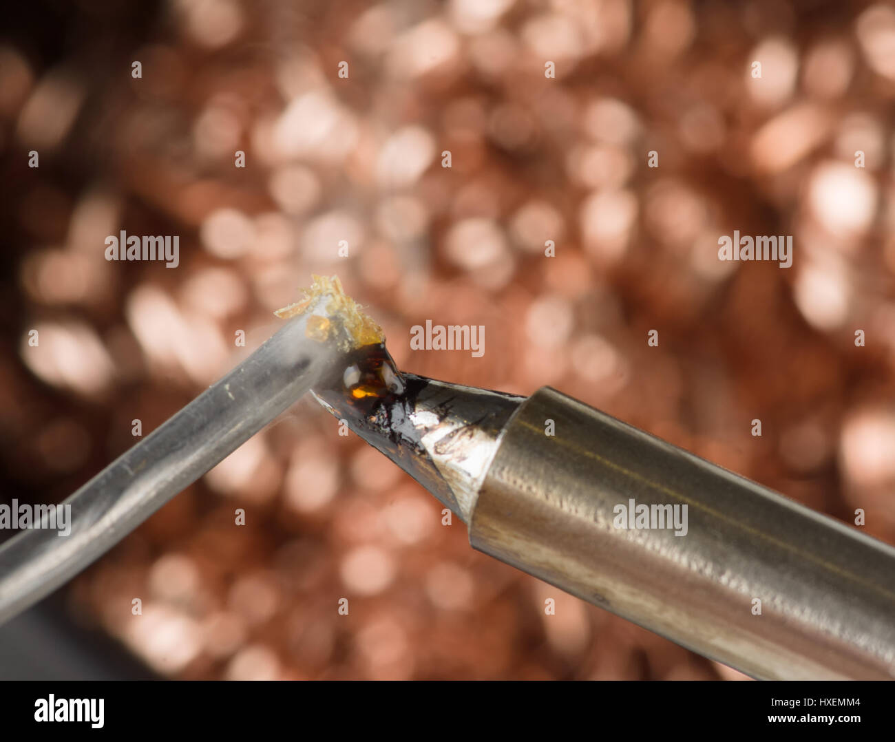 Metal chips in the tank is used to clean the soldering iron from the ...