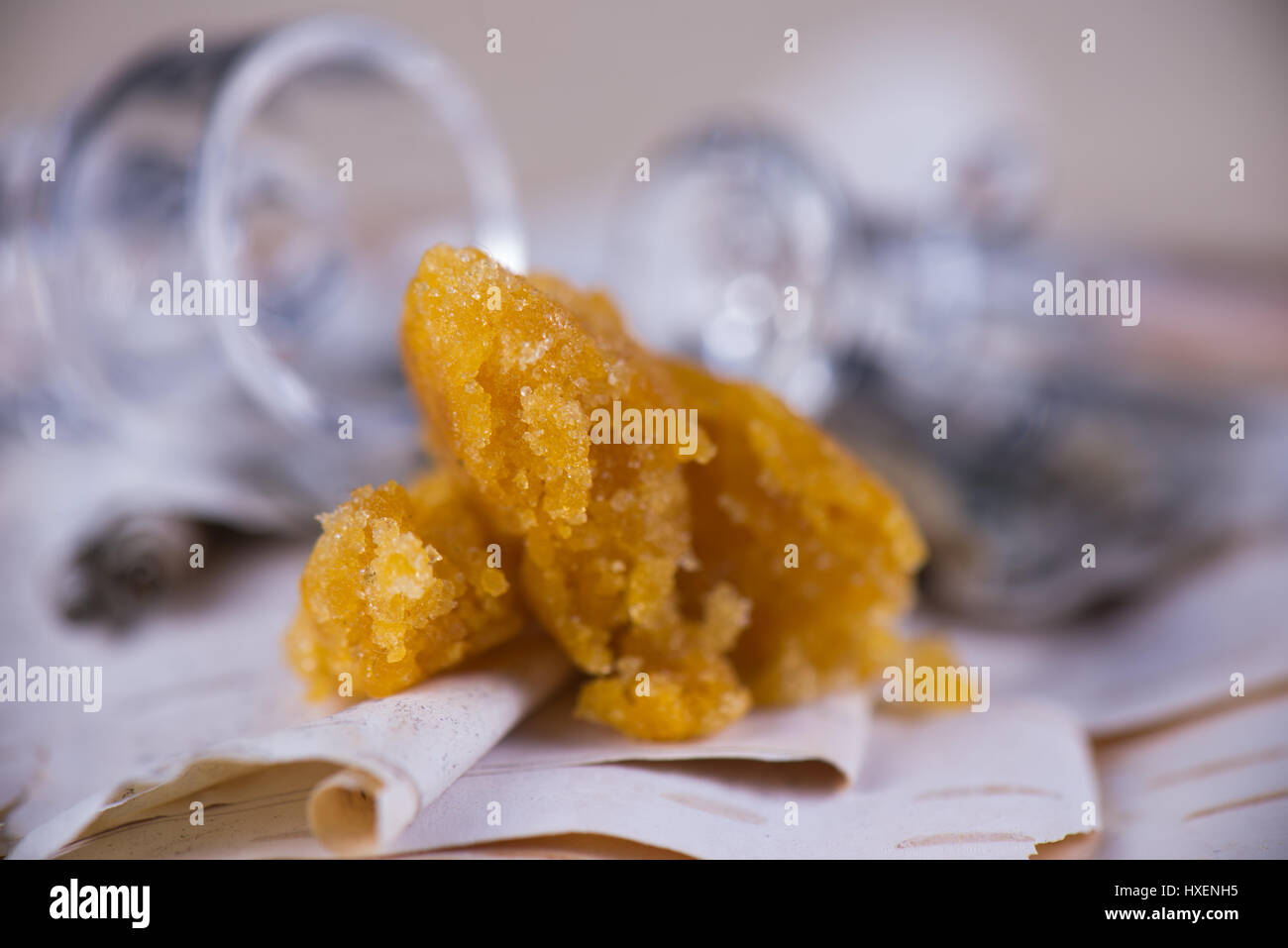Detail of marijuana extraction concentrate aka wax crumble on wood ...