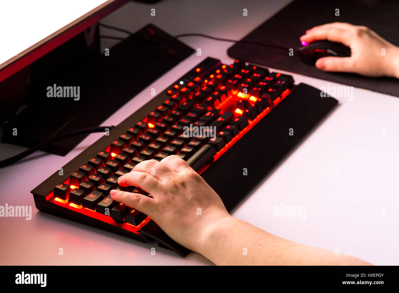 Female hands playing computer game with gaming gear Stock Photo - Alamy
