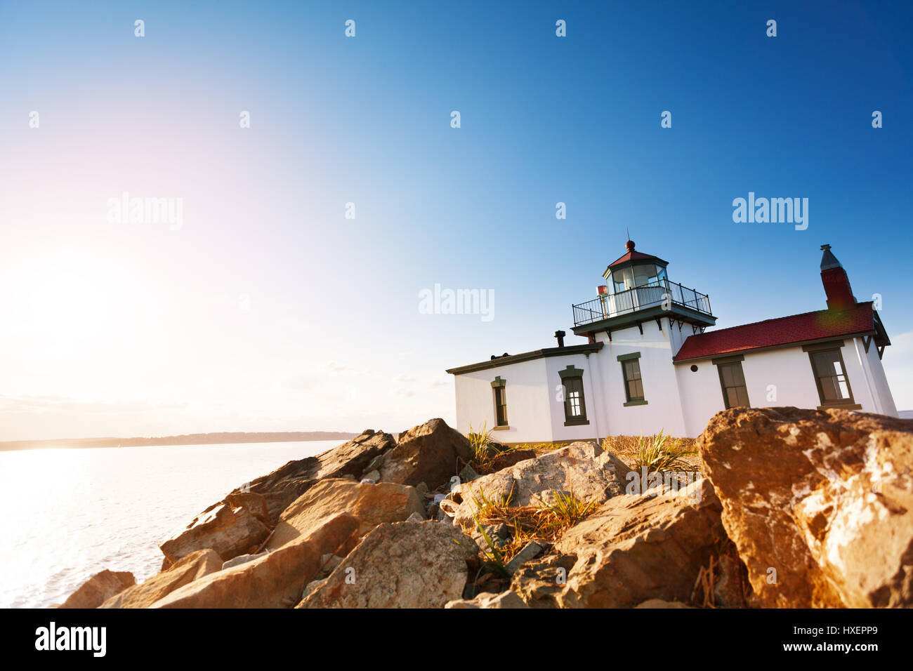 Scenic rock formations on the beach with West Point Lighthouse on the ...