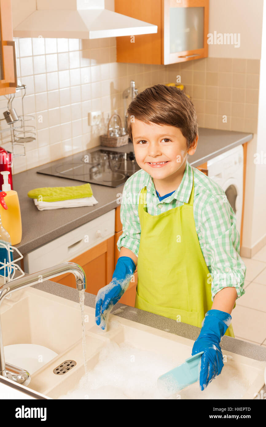 Boy washing dishes hi-res stock photography and images - Alamy