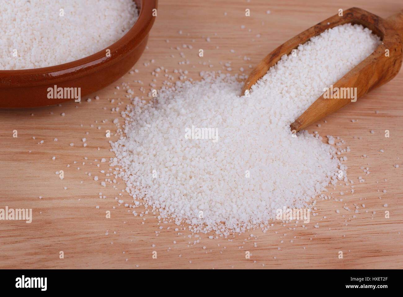 Granulated cassava (tapioca) on wooden background. Selective focus ...