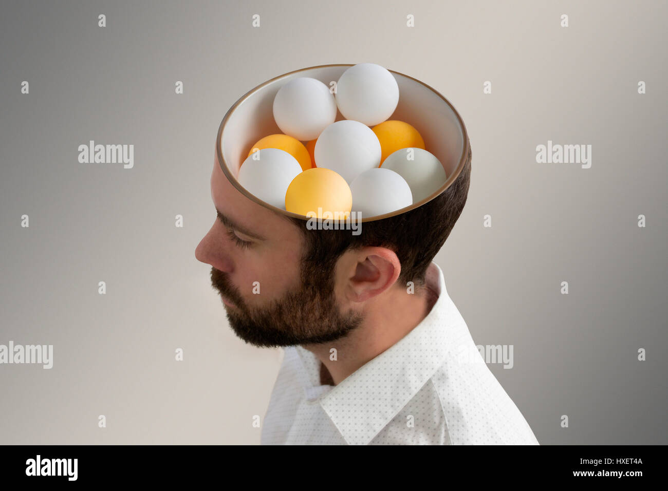 Ping pong balls inside a man's head Stock Photo - Alamy
