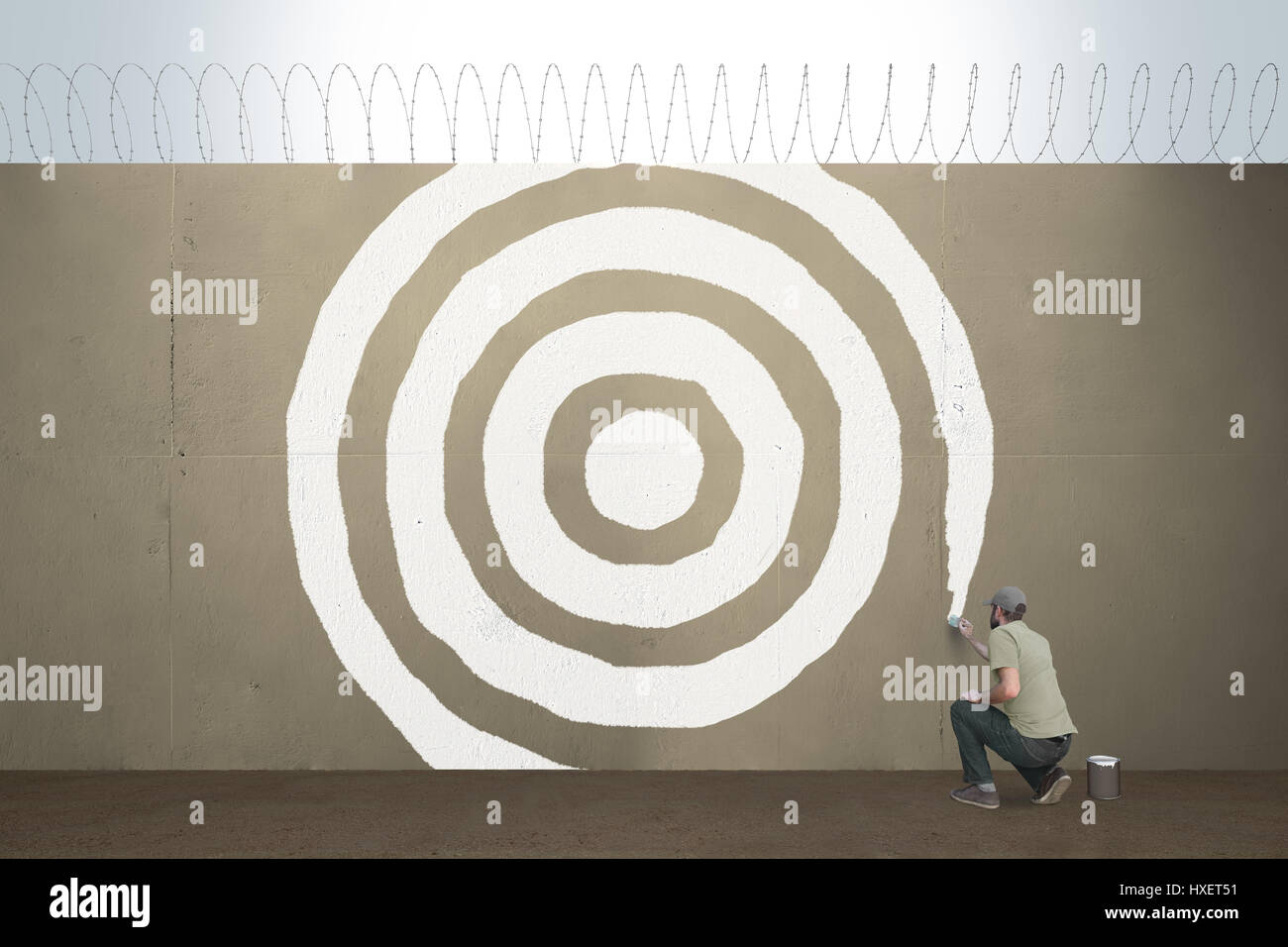 A man draws a target on a border barrier Stock Photo - Alamy