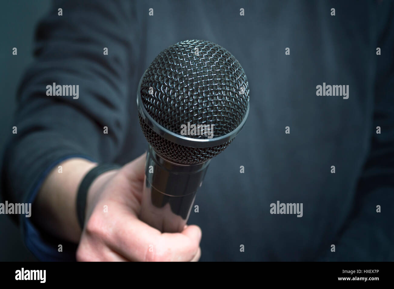 Journalist making speech with microphone and hand gesturing concept for ...
