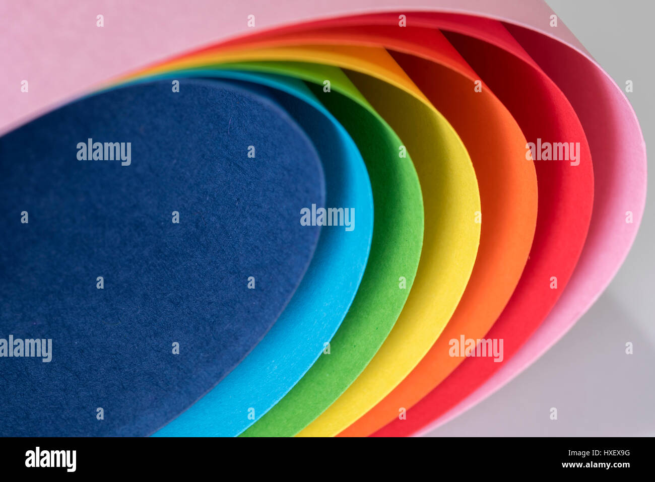 Sheets of rainbow colored card with graceful flowing curves Stock Photo ...
