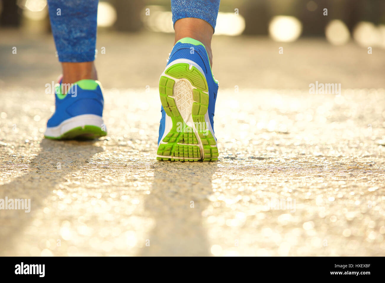 Low angle close up female running shoes outside Stock Photo - Alamy