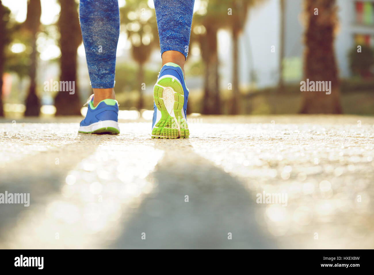 Close up low angle female running shoes from behind Stock Photo - Alamy