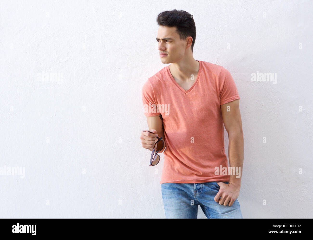 Portrait of one handsome man standing against white background Stock ...