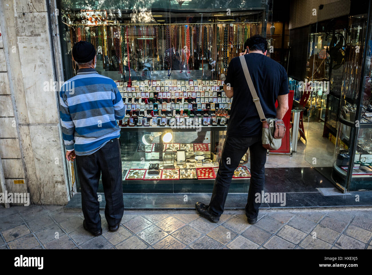 Iranian men in front of jeweler shop window in Tehran city, capital of ...