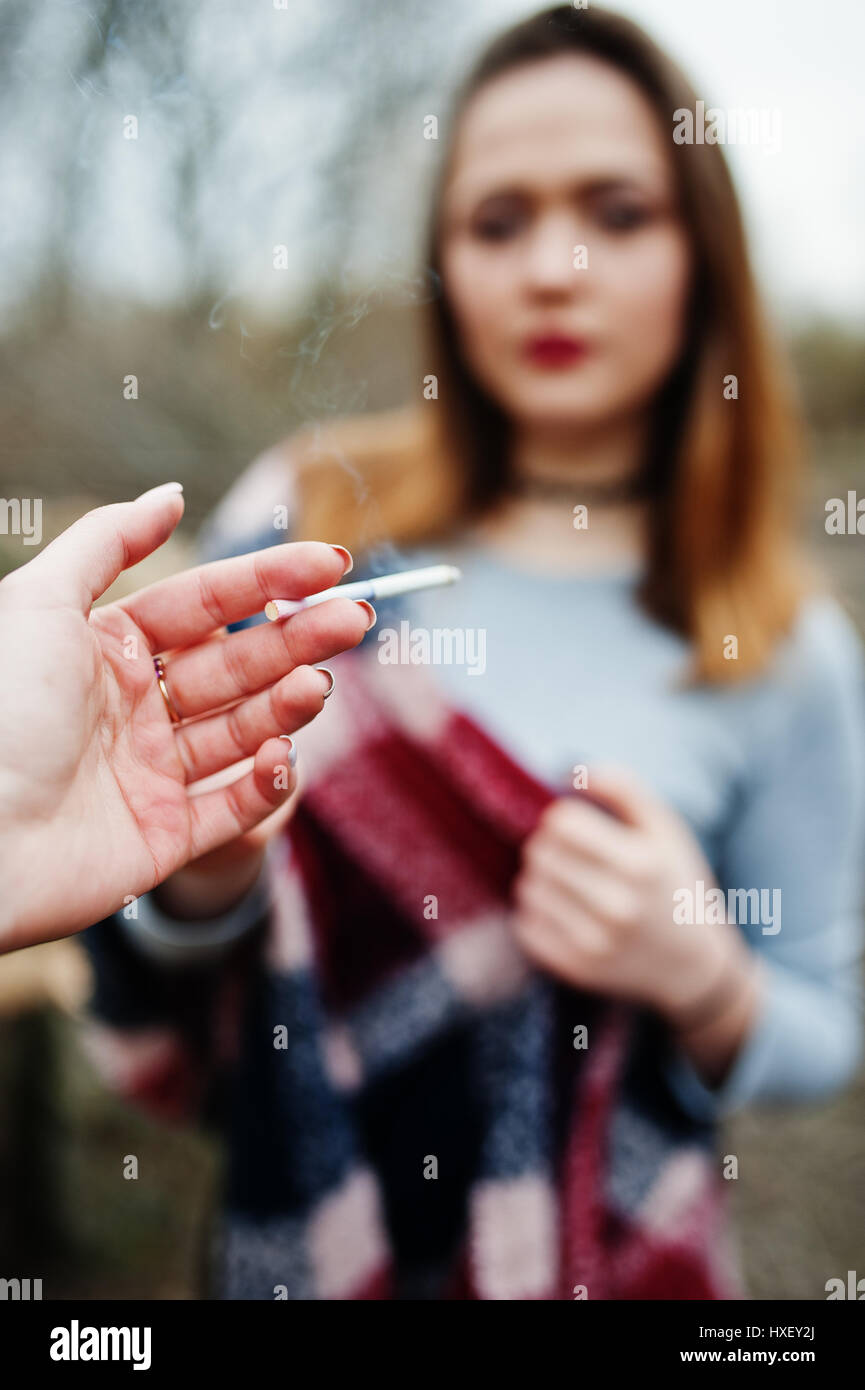Hand of girl with cigarette. Stop smoking social problem. Friend give ...