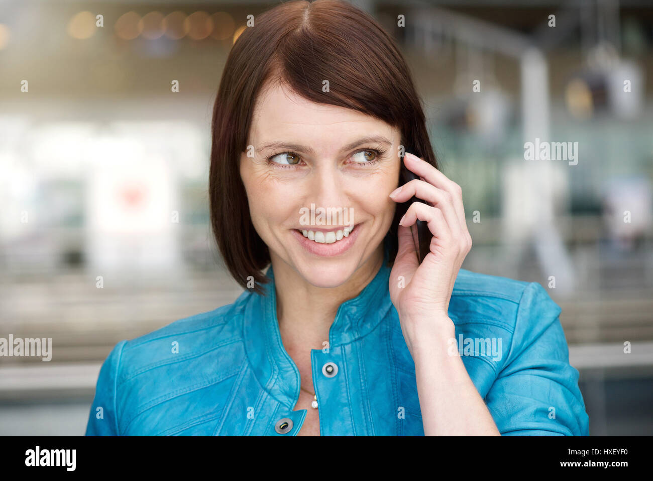Close up portrait of a middle aged woman using cell phone Stock Photo ...
