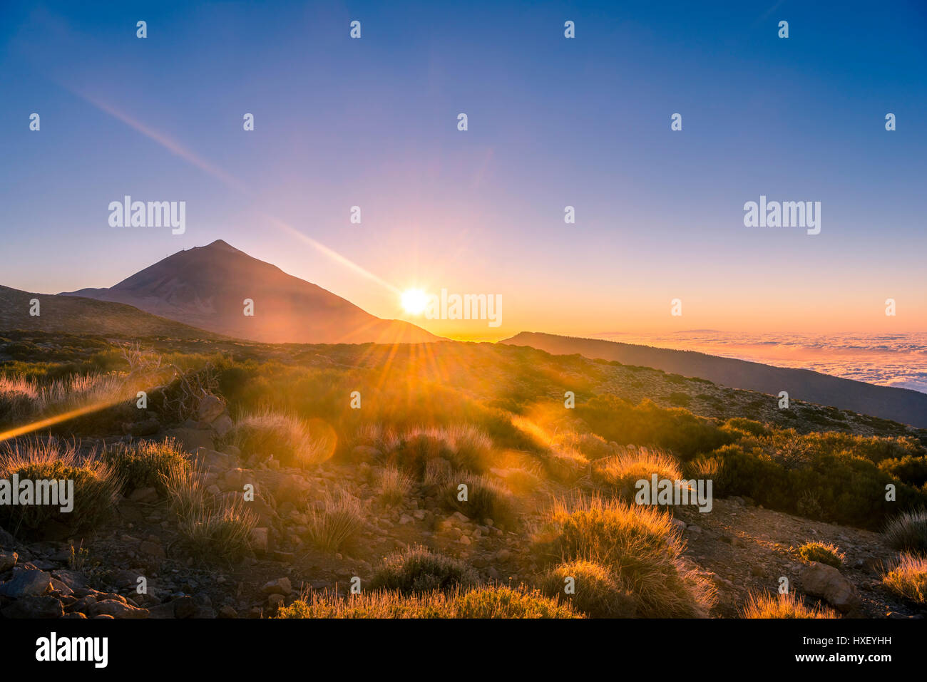 Sunset, sunset glow, cloudy sky, Volcano Teide and volcano landscape ...