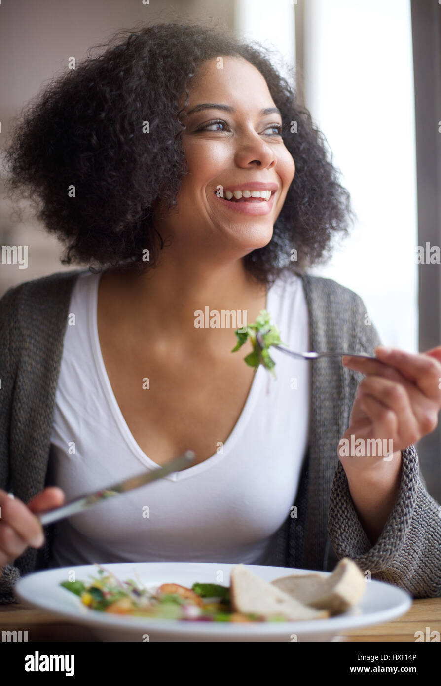 African woman eating salad hi-res stock photography and images - Alamy