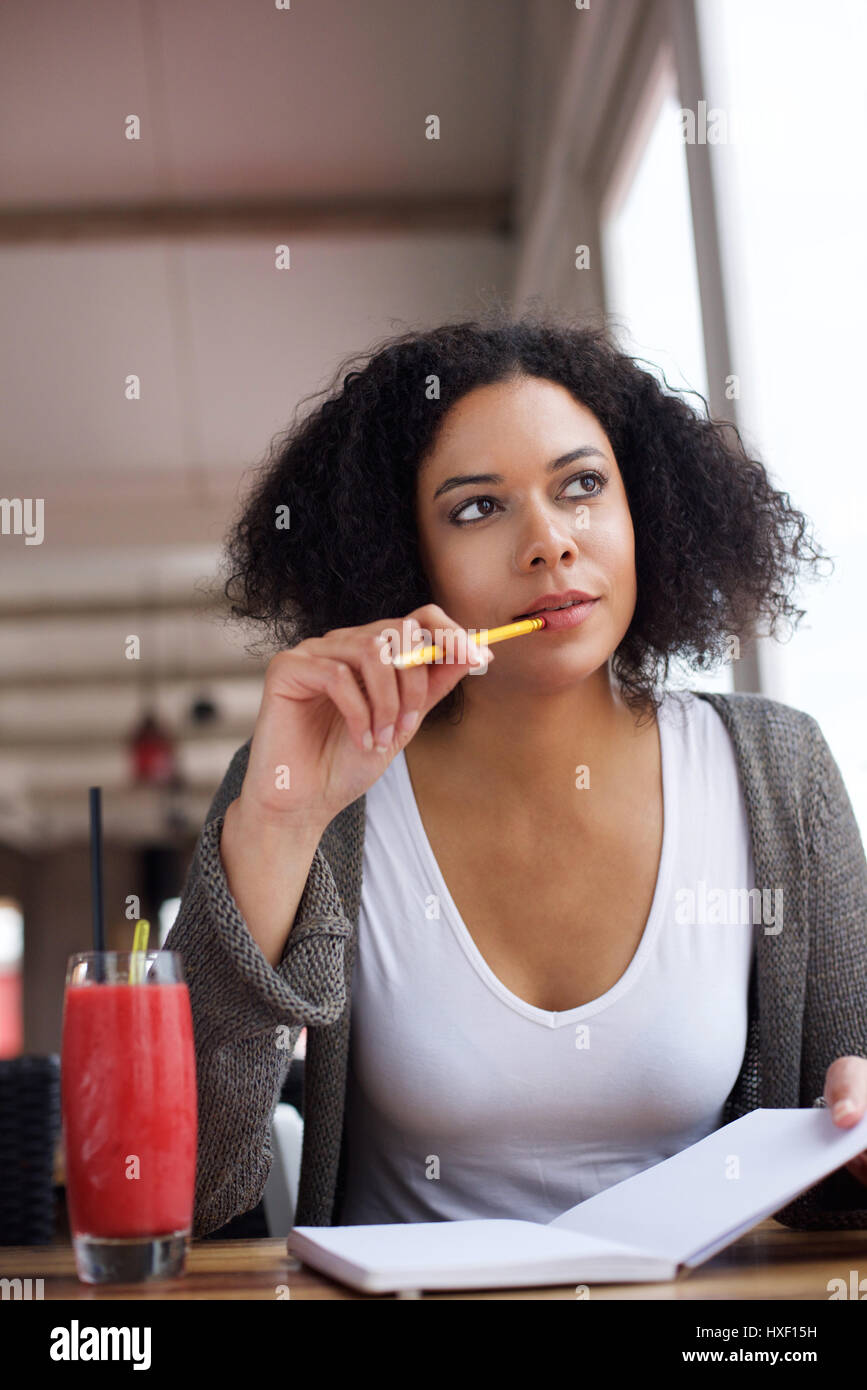 Portrait of a female college student thinking Stock Photo - Alamy Portrait of a female college student thinking Stock Photo - Alamy