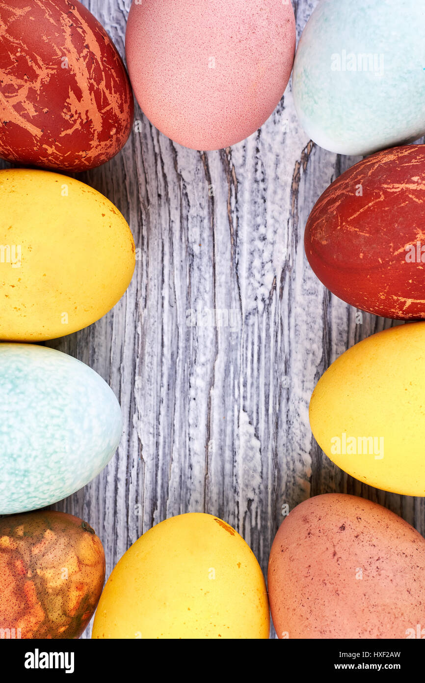 Colored eggs and wood texture Stock Photo - Alamy