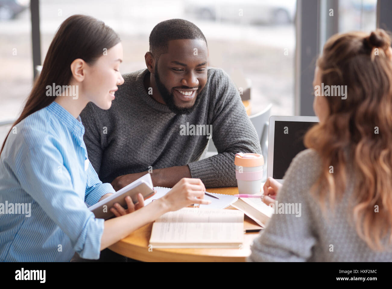 Group of young people studying together Stock Photo - Alamy