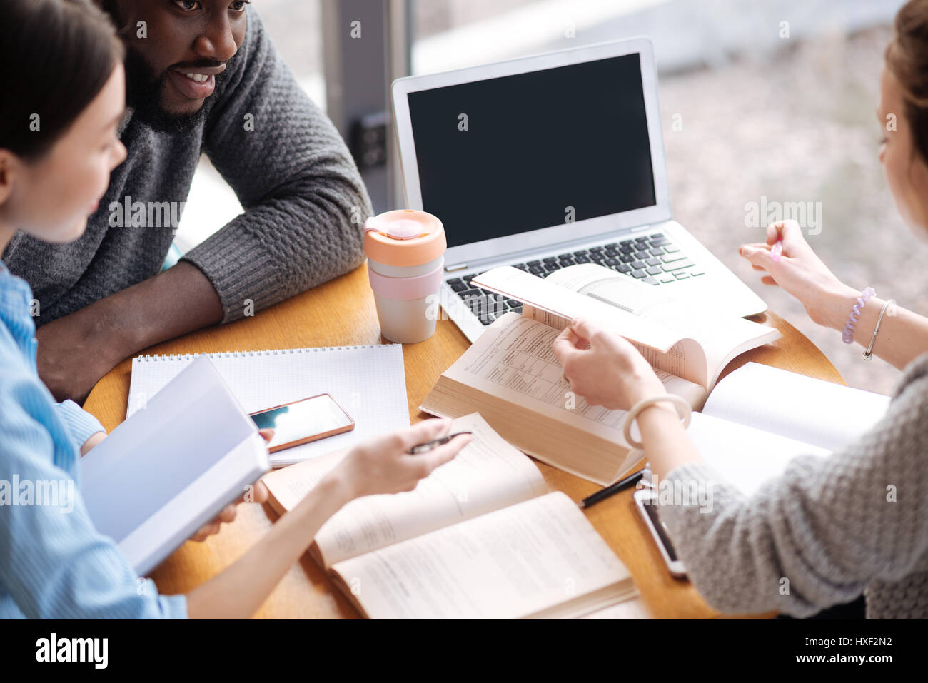 Group of students studying together Stock Photo - Alamy
