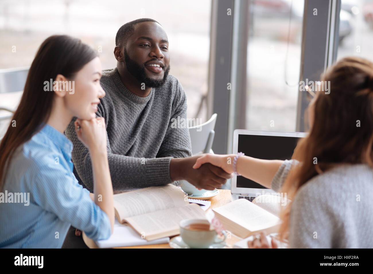 Three fellow students learning together Stock Photo - Alamy