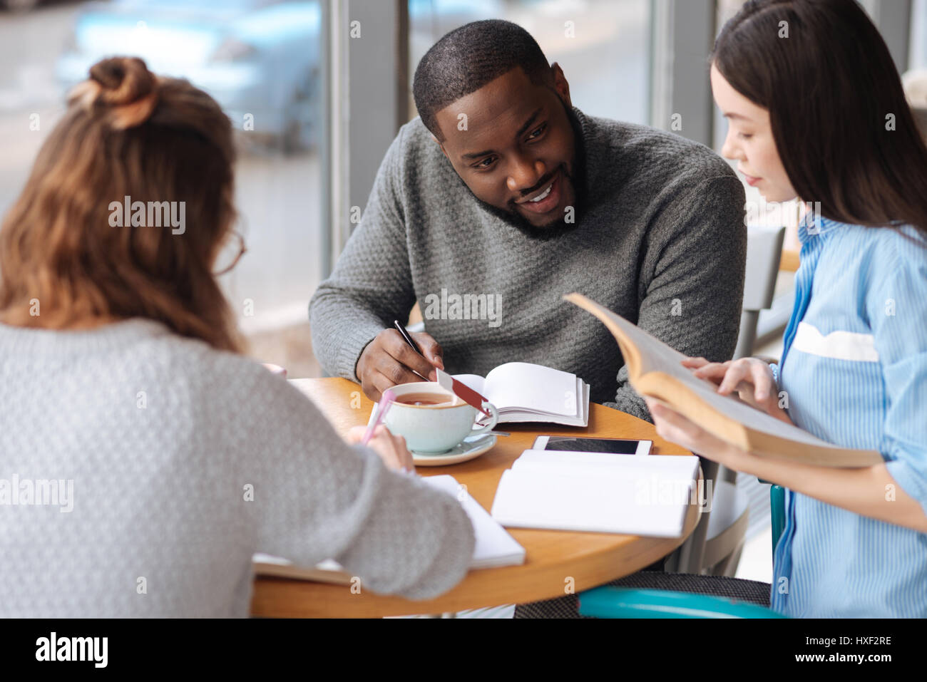 Happy student studying together Stock Photo - Alamy