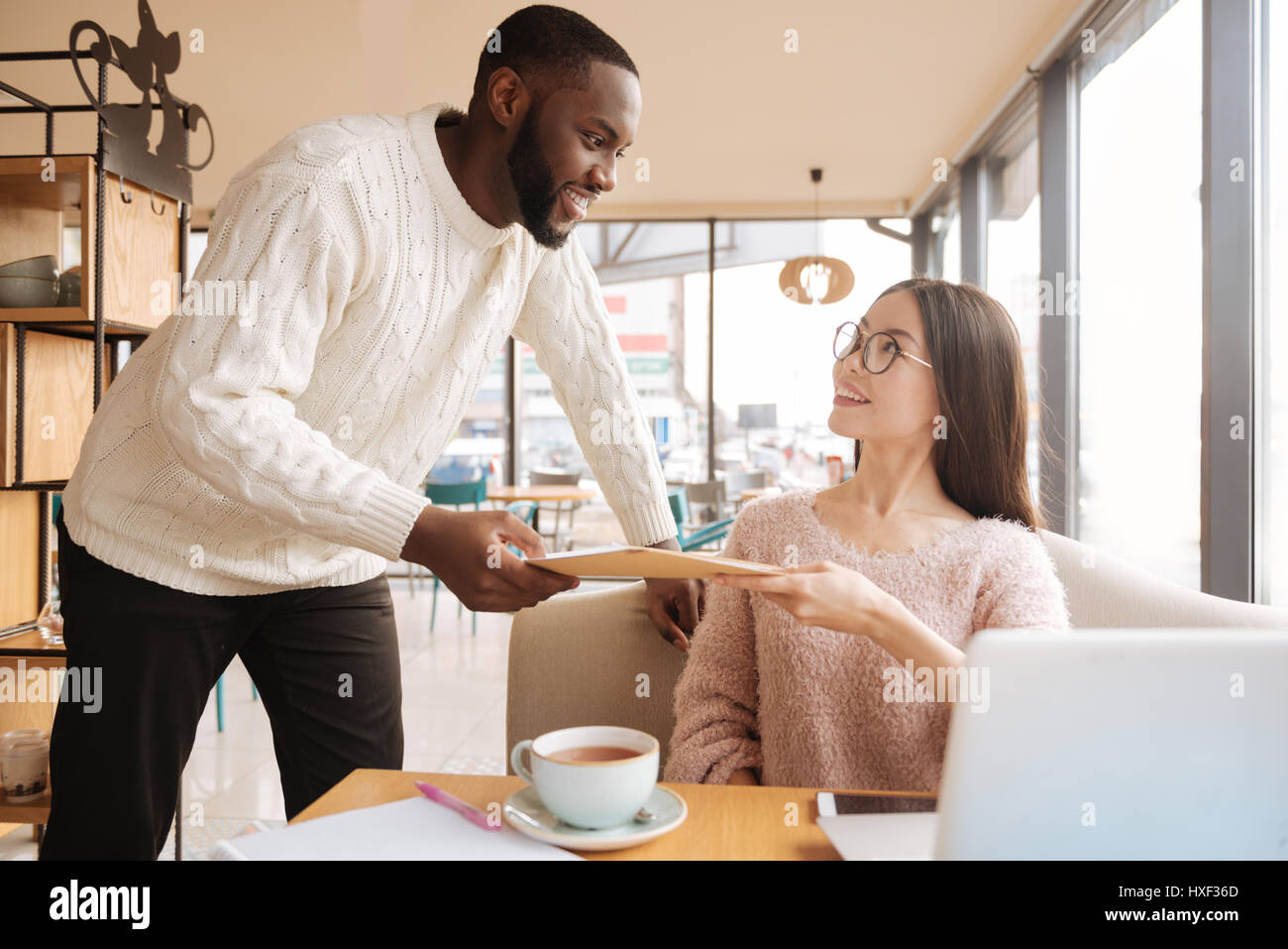 Students sharing notes in university hi-res stock photography and ...