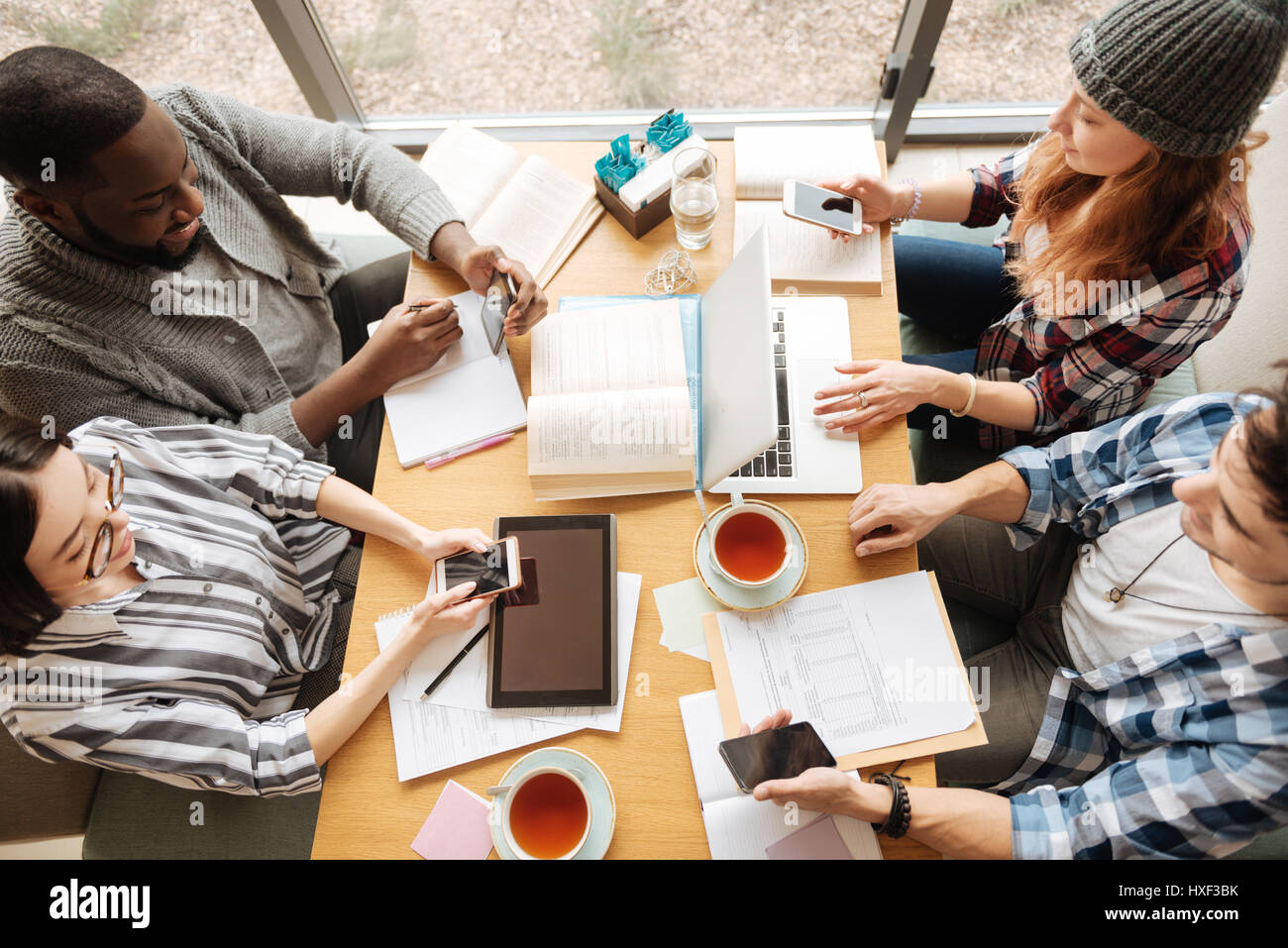 Top view of students studying together Stock Photo - Alamy