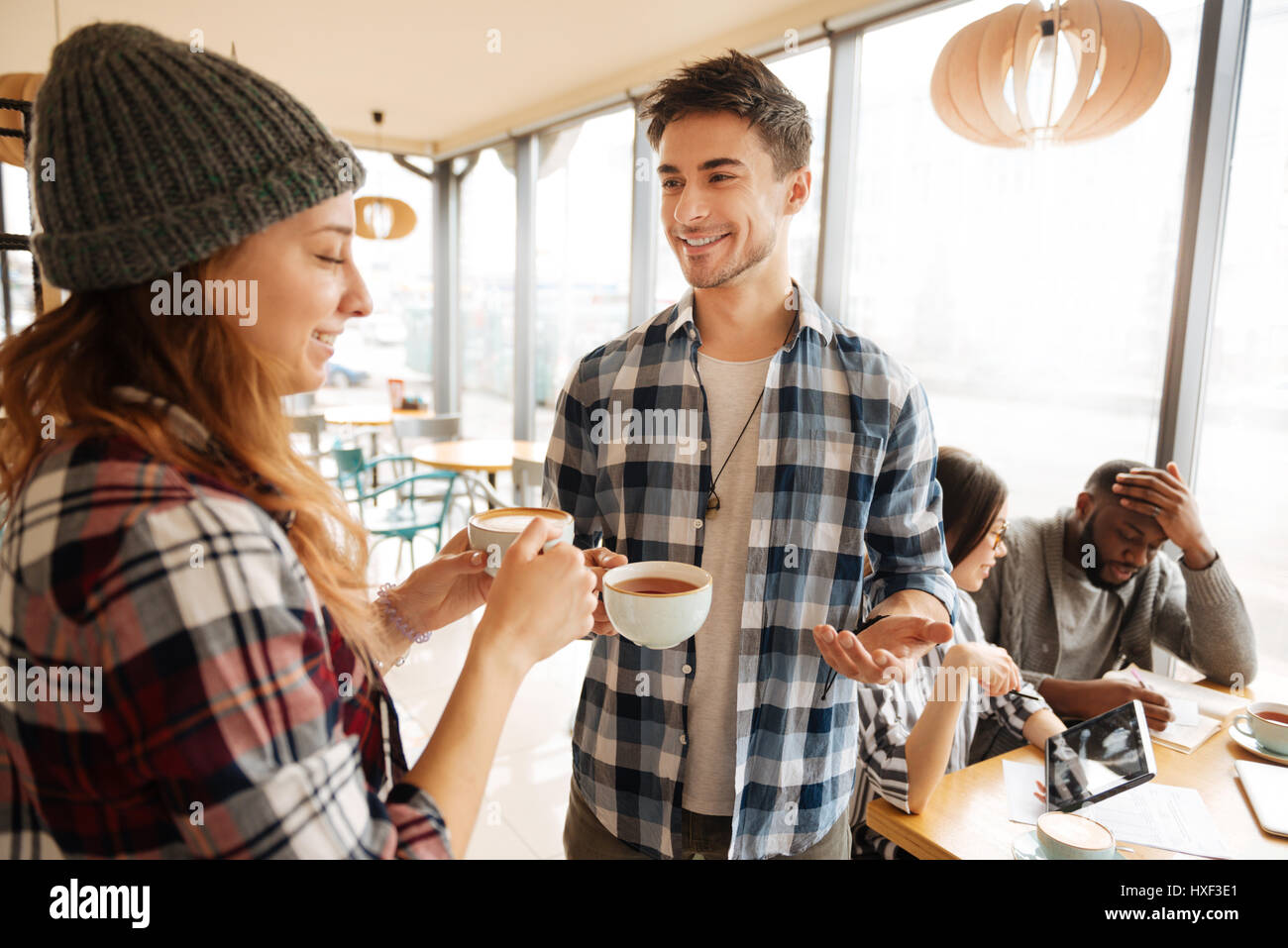 Nice guy and girl having conversation Stock Photo - Alamy